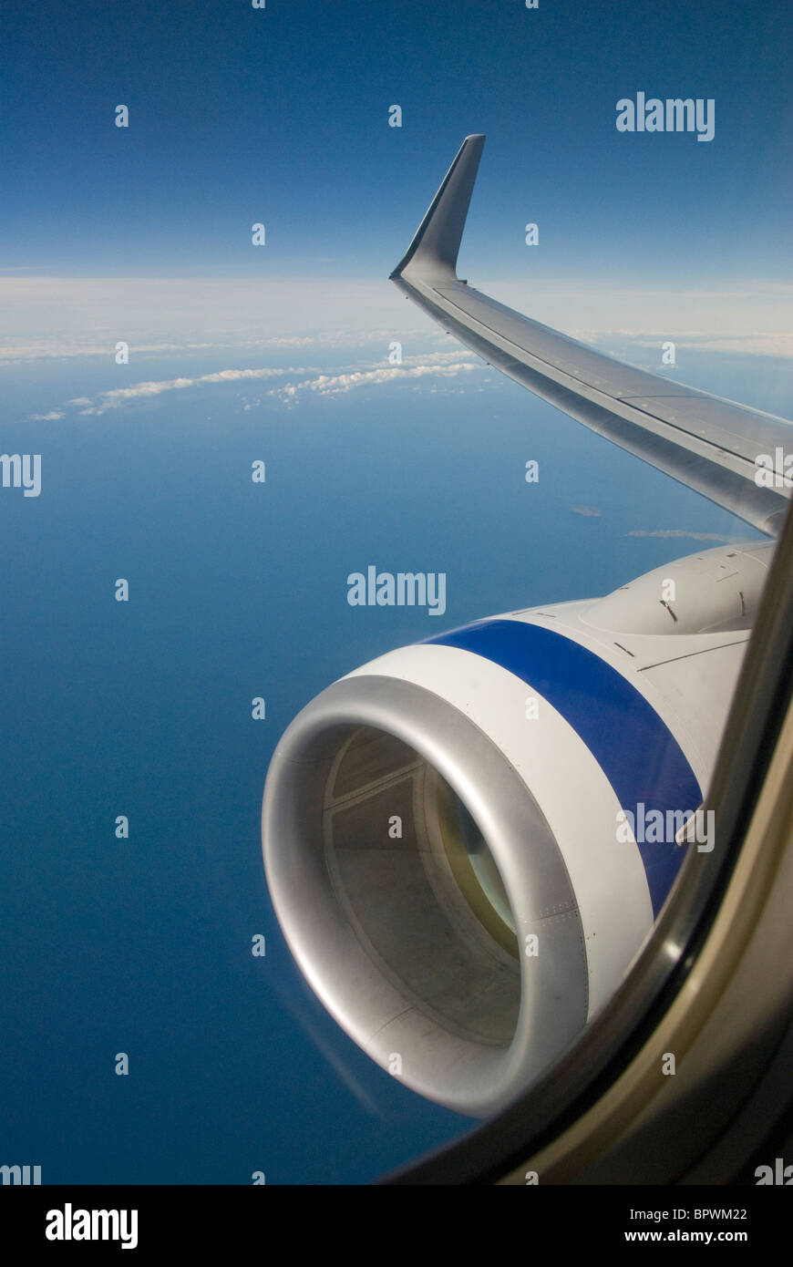 Wing of aeroplane over ocean island hi-res stock photography and images ...