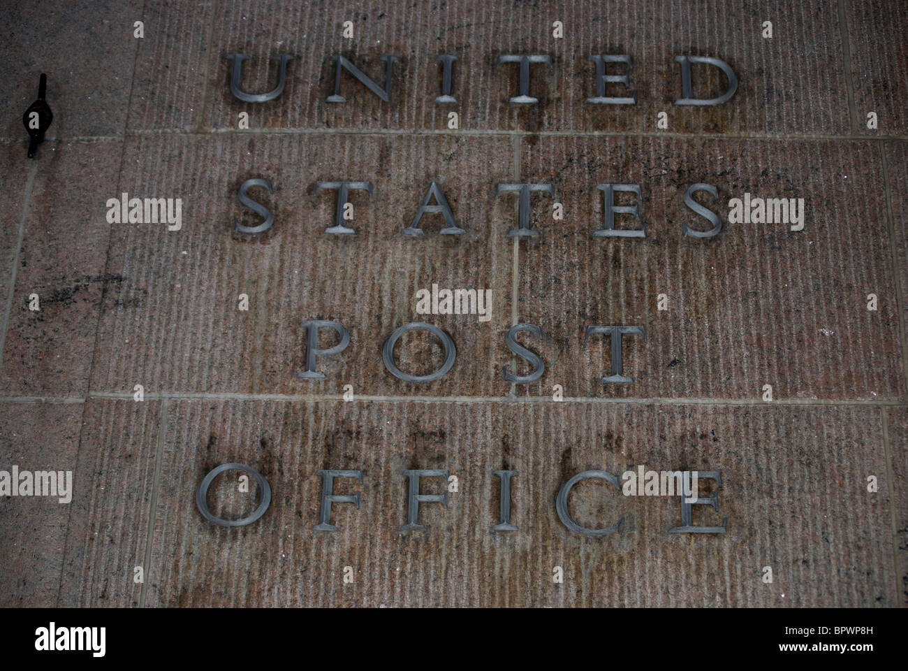 United States Post Office letters fixed to the building wall of the ...