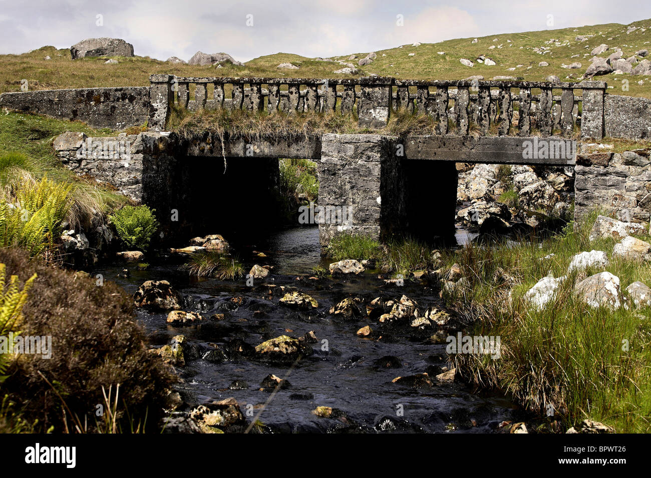 Water stream flowing under old concrete bridge county galway ireland hi ...