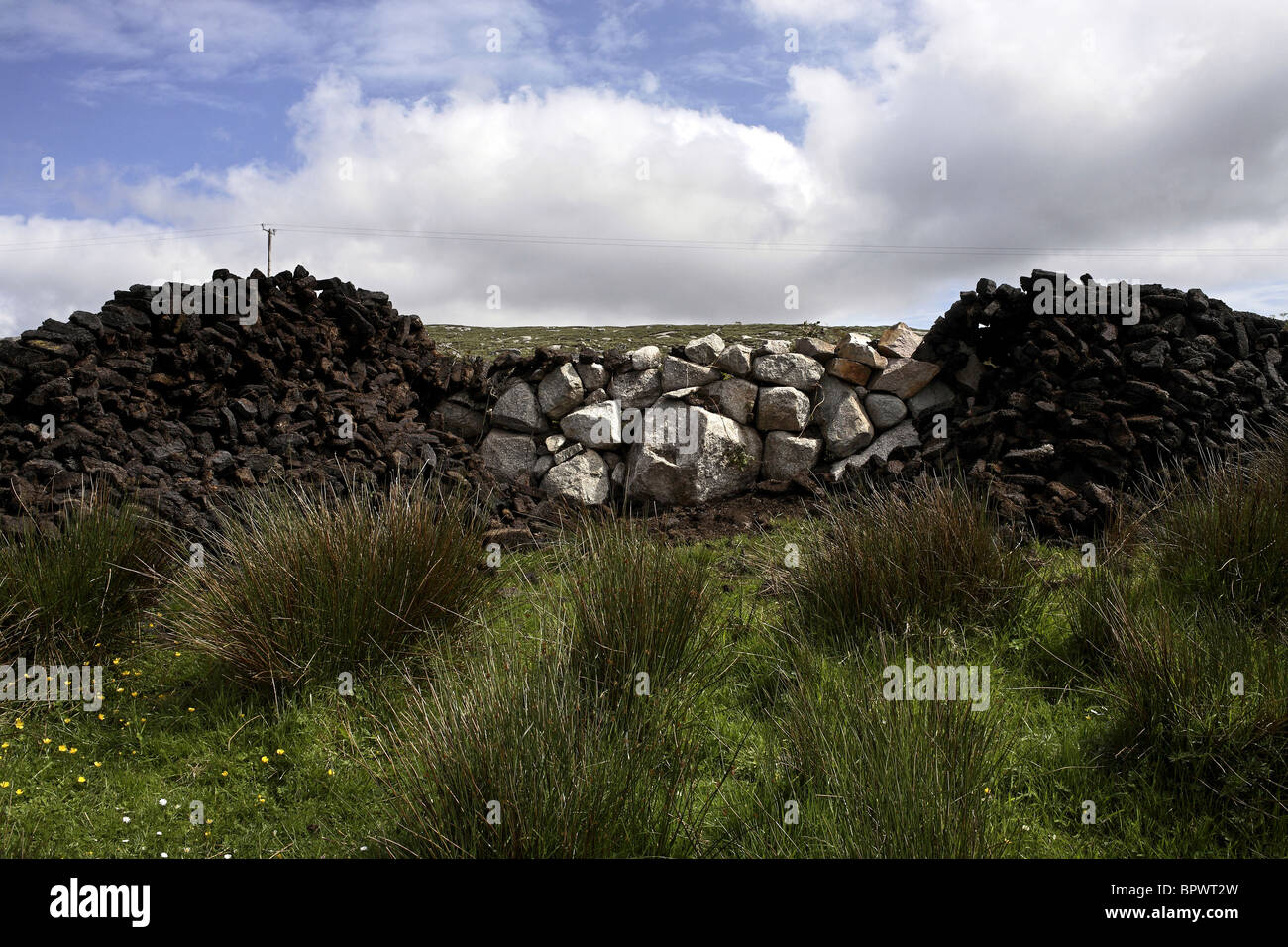 Turf and wall fence connemara county galway ireland hi-res stock ...