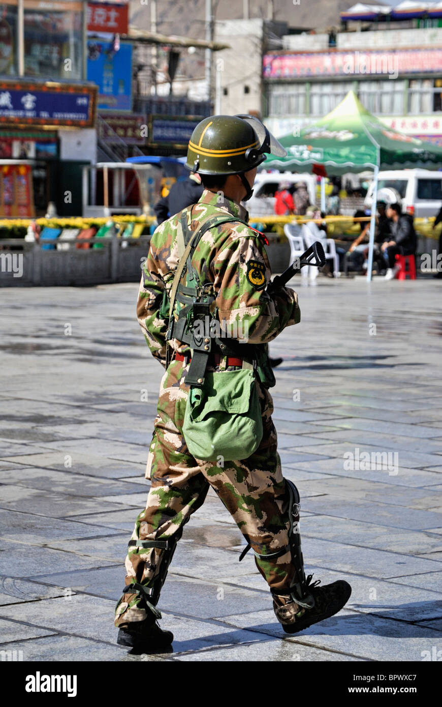 Chinese soldier patrolling Barkhor Square,Lhasa,Tibet,China Stock Photo ...
