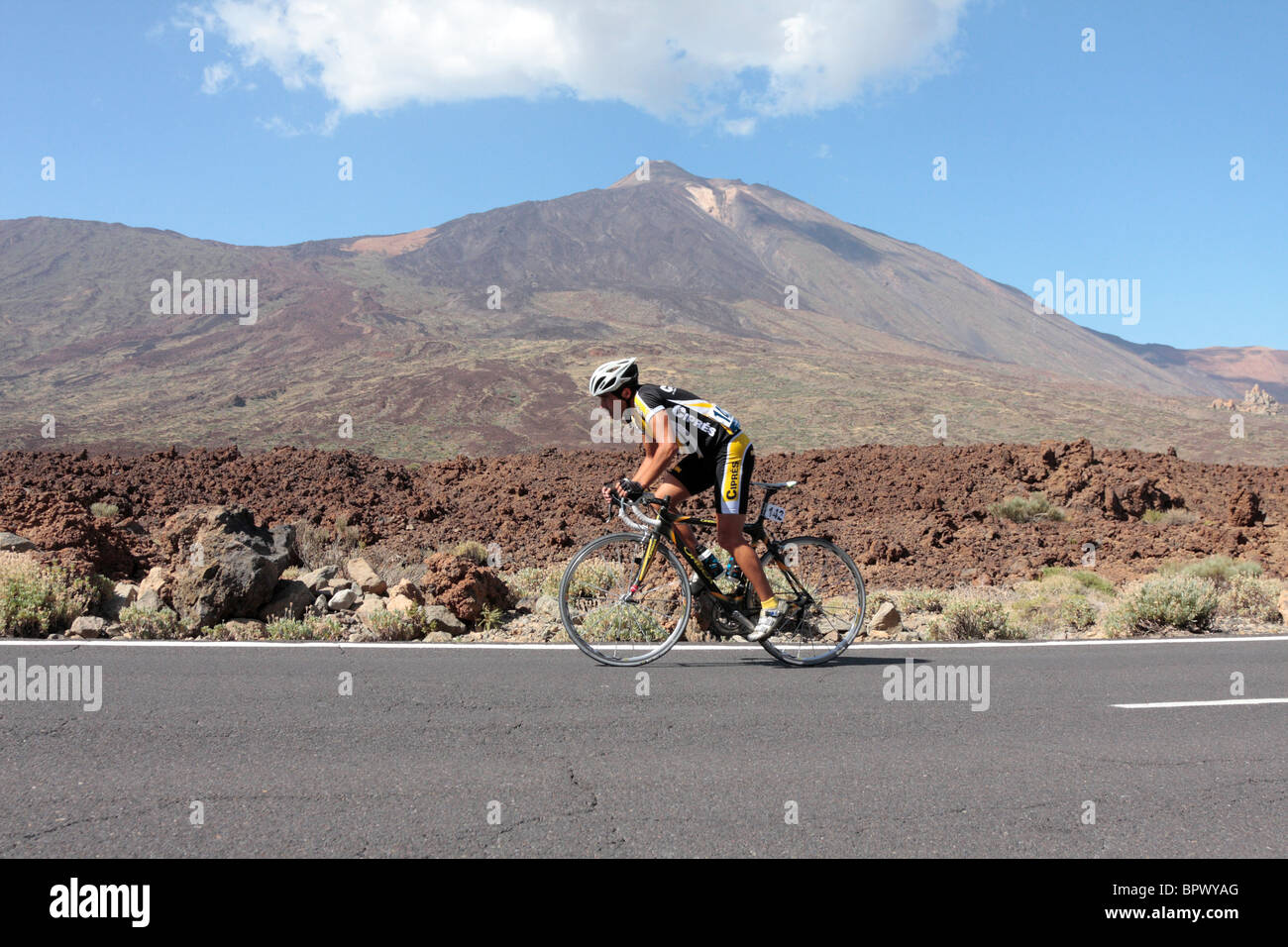 A cyclist in front of mount Teide on the fourth stage of the Tour of ...