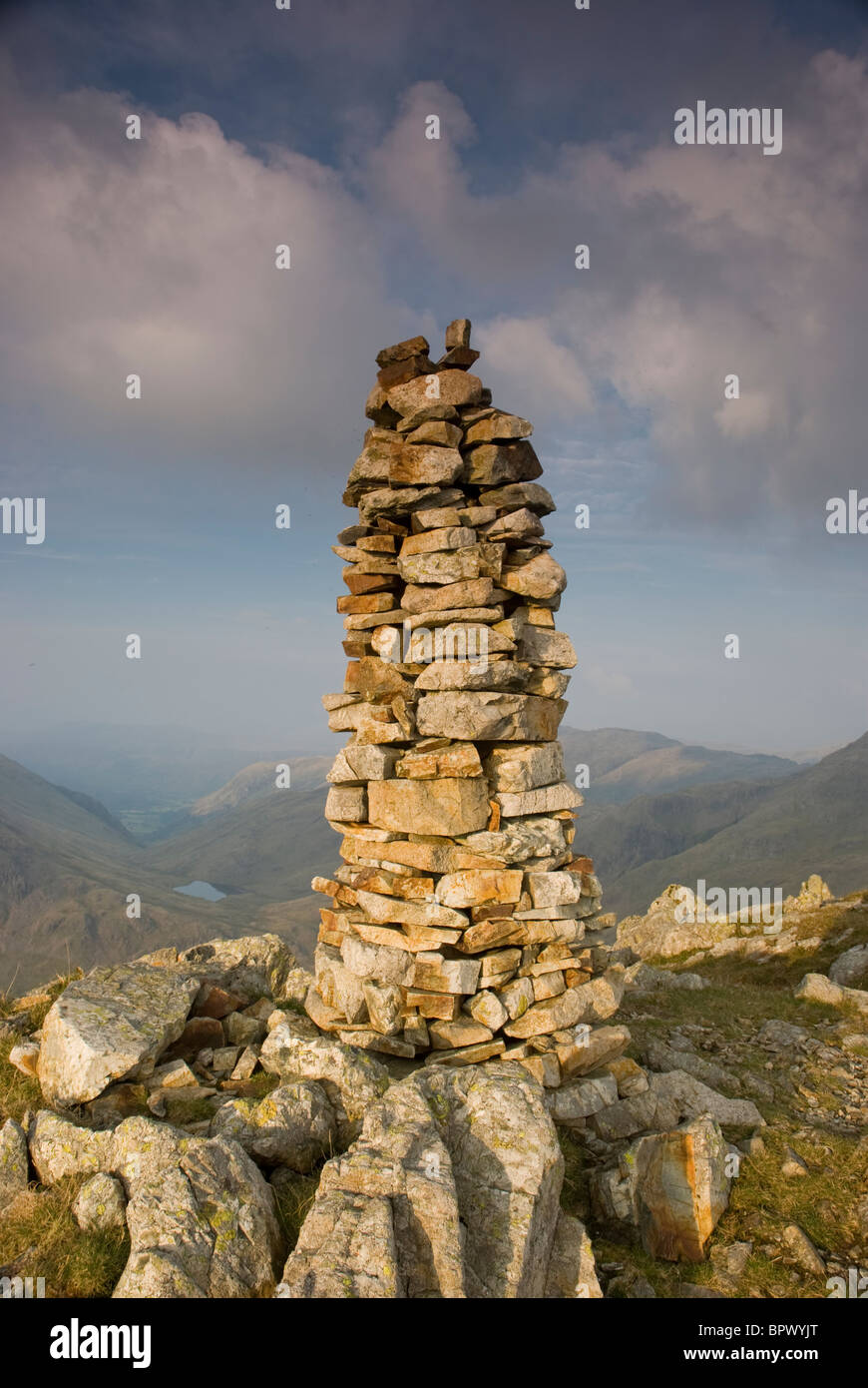 Tall cairn on Lingmell, in the Lake District, Cumbria, looking towards ...