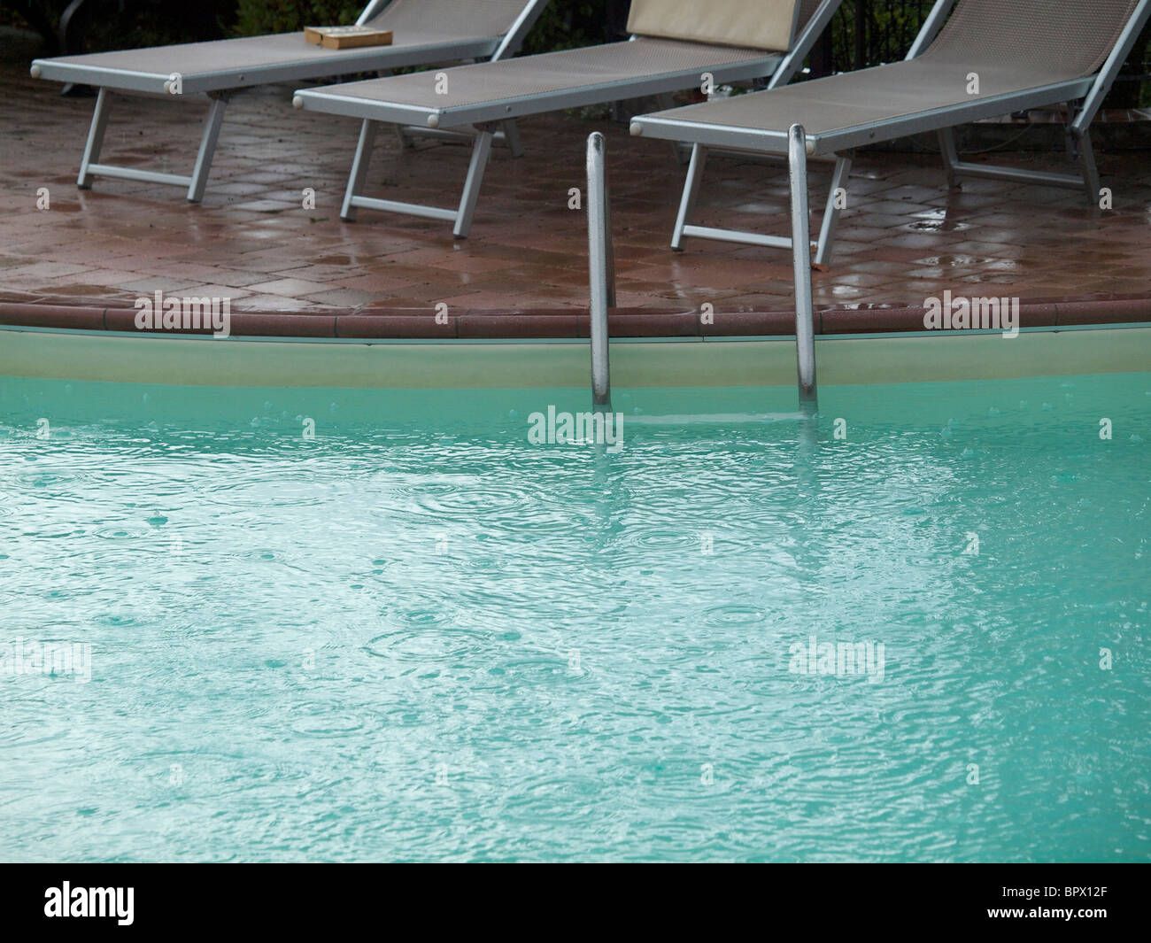 Raindrops falling in swimming pool hi-res stock photography and images ...