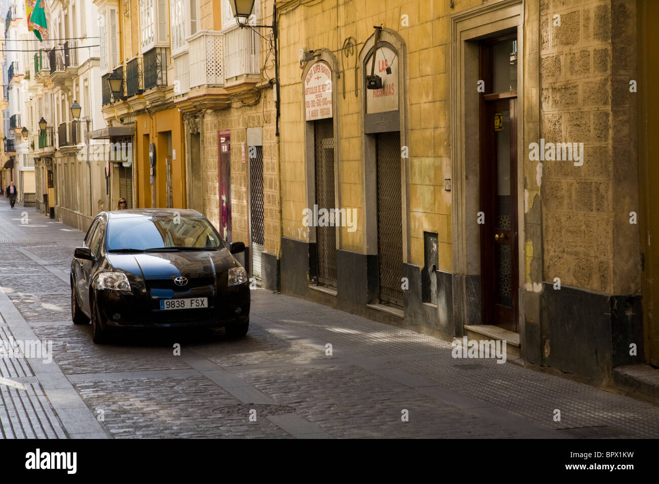 Typical traditional Spanish cobbled back street / streets / road, with ...