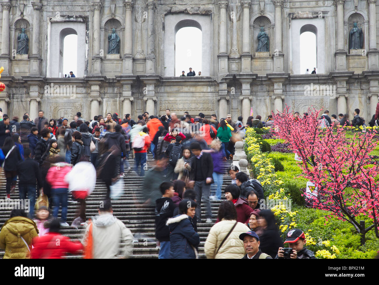 Crowds of people on steps of ruins of the Church of St Paul, Macau ...