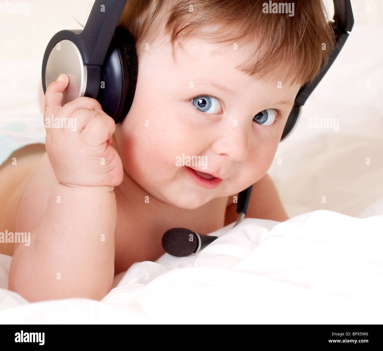 face portrait of beautiful baby with headset Stock Photo - Alamy