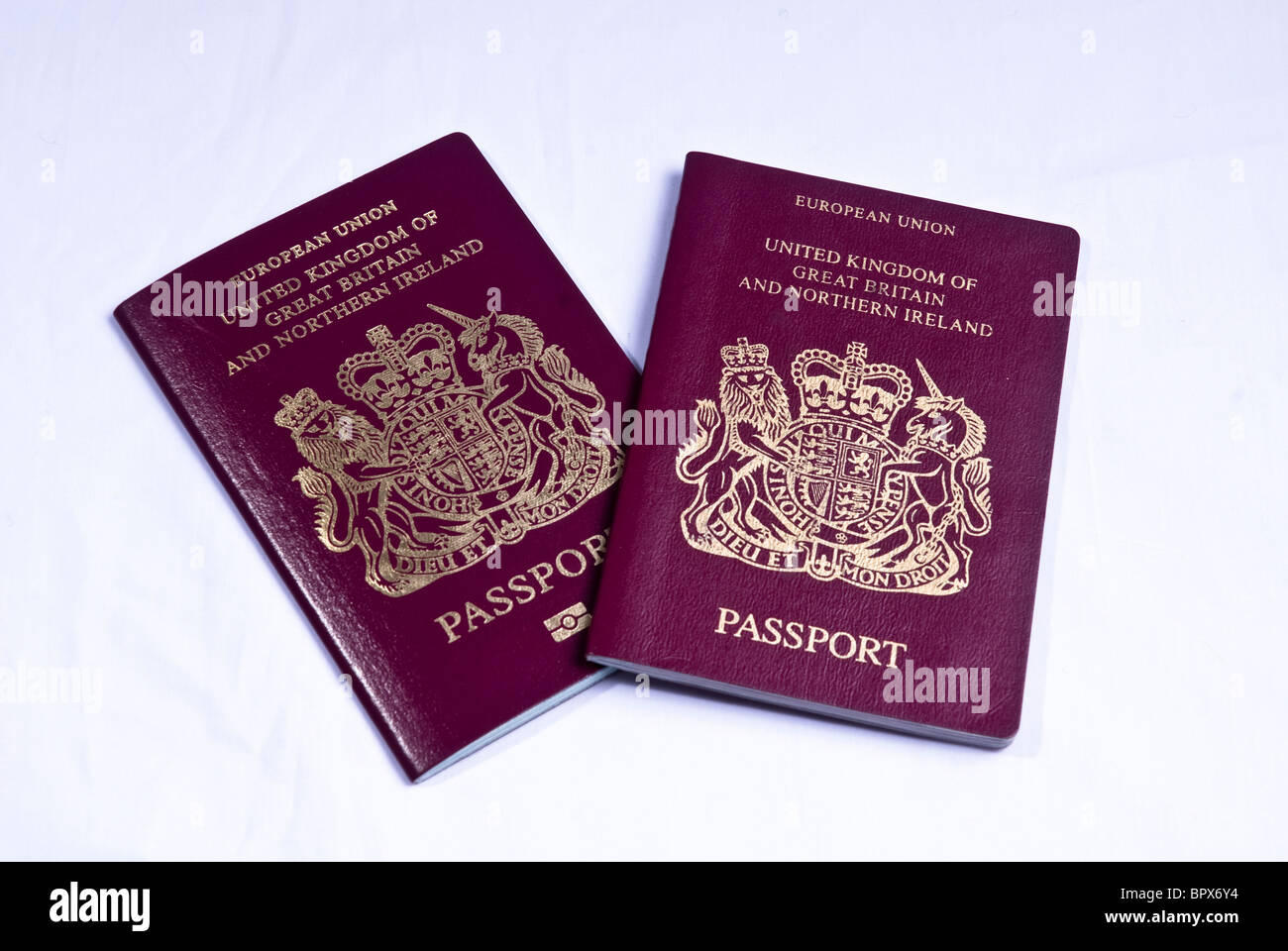 United Kingdom Passports on a table, face-up showing the crest and ...