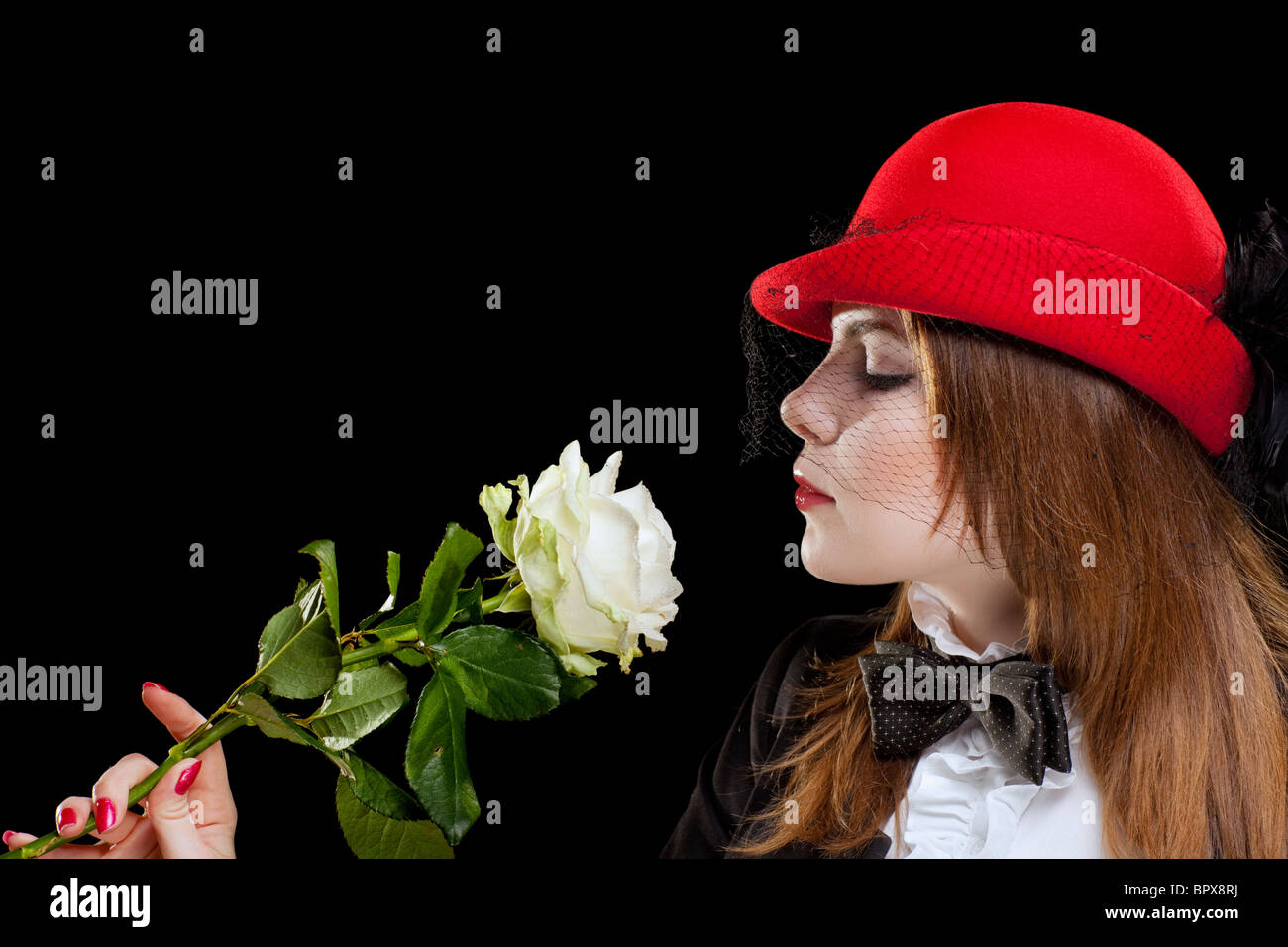 Portrait of a pretty young woman with red bonnet Stock Photo - Alamy