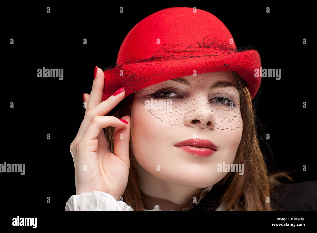 Portrait of a pretty young woman with red bonnet Stock Photo - Alamy