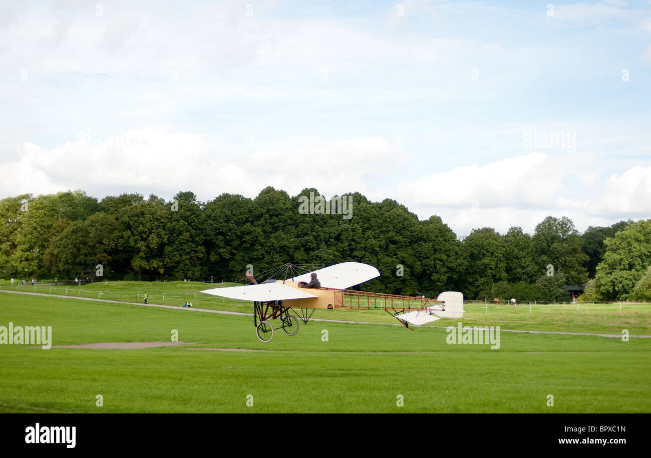 Ancient type of airplane taking off a few meters off the ground. Old ...