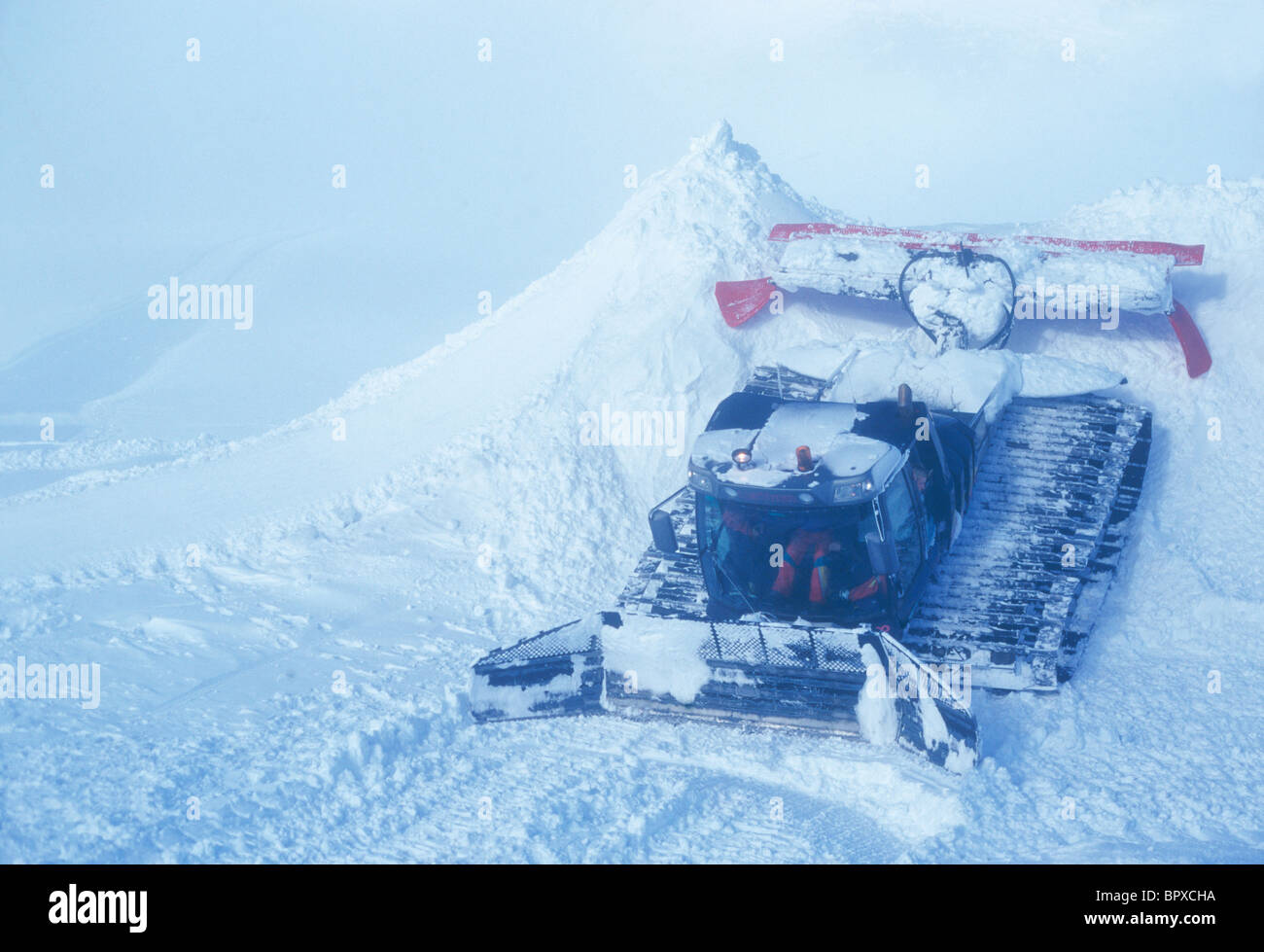 Snowcat building terrain park Stock Photo - Alamy