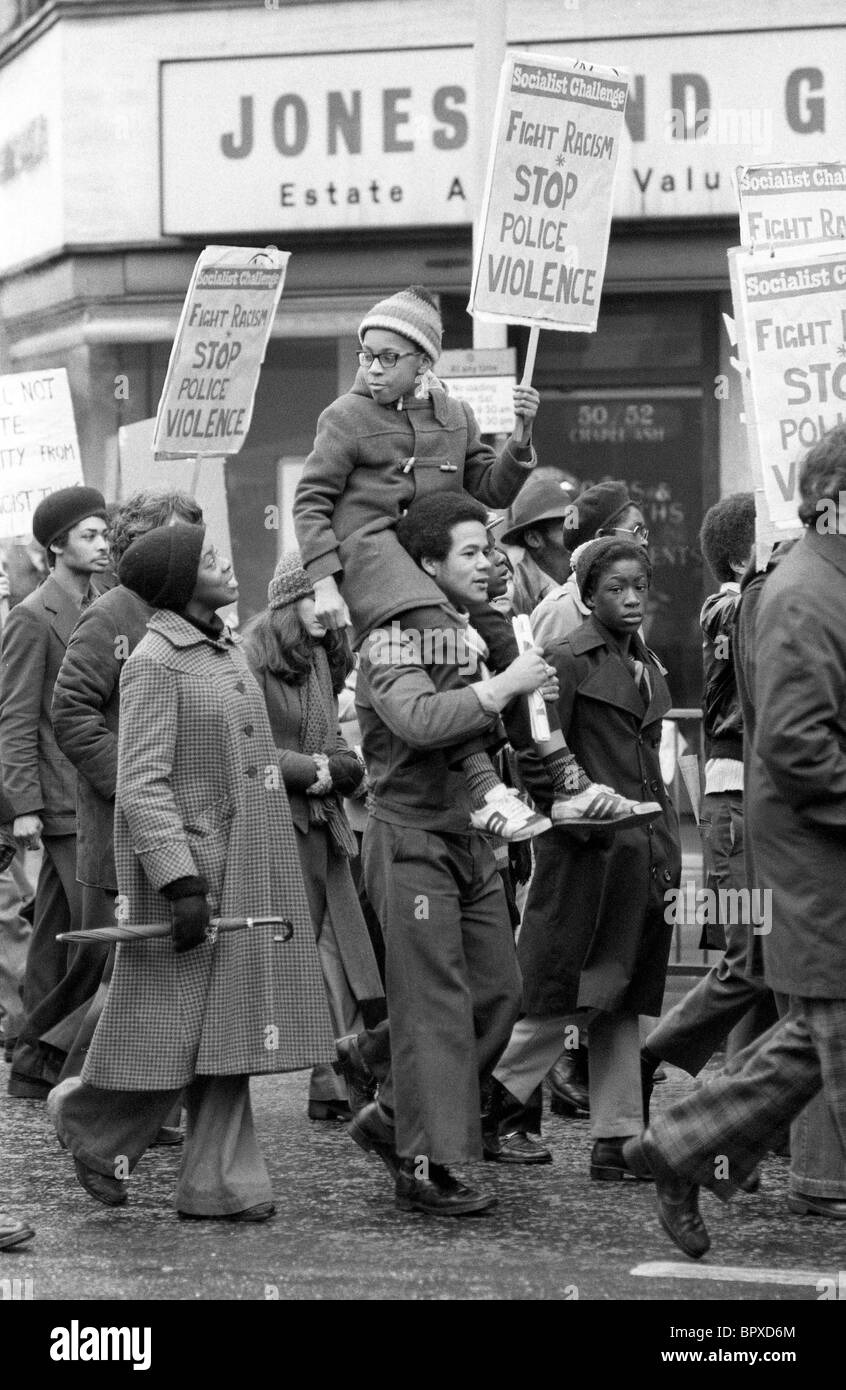 Young boy on mans shoulders during Wolverhampton Anti Nazi march 1981 ...