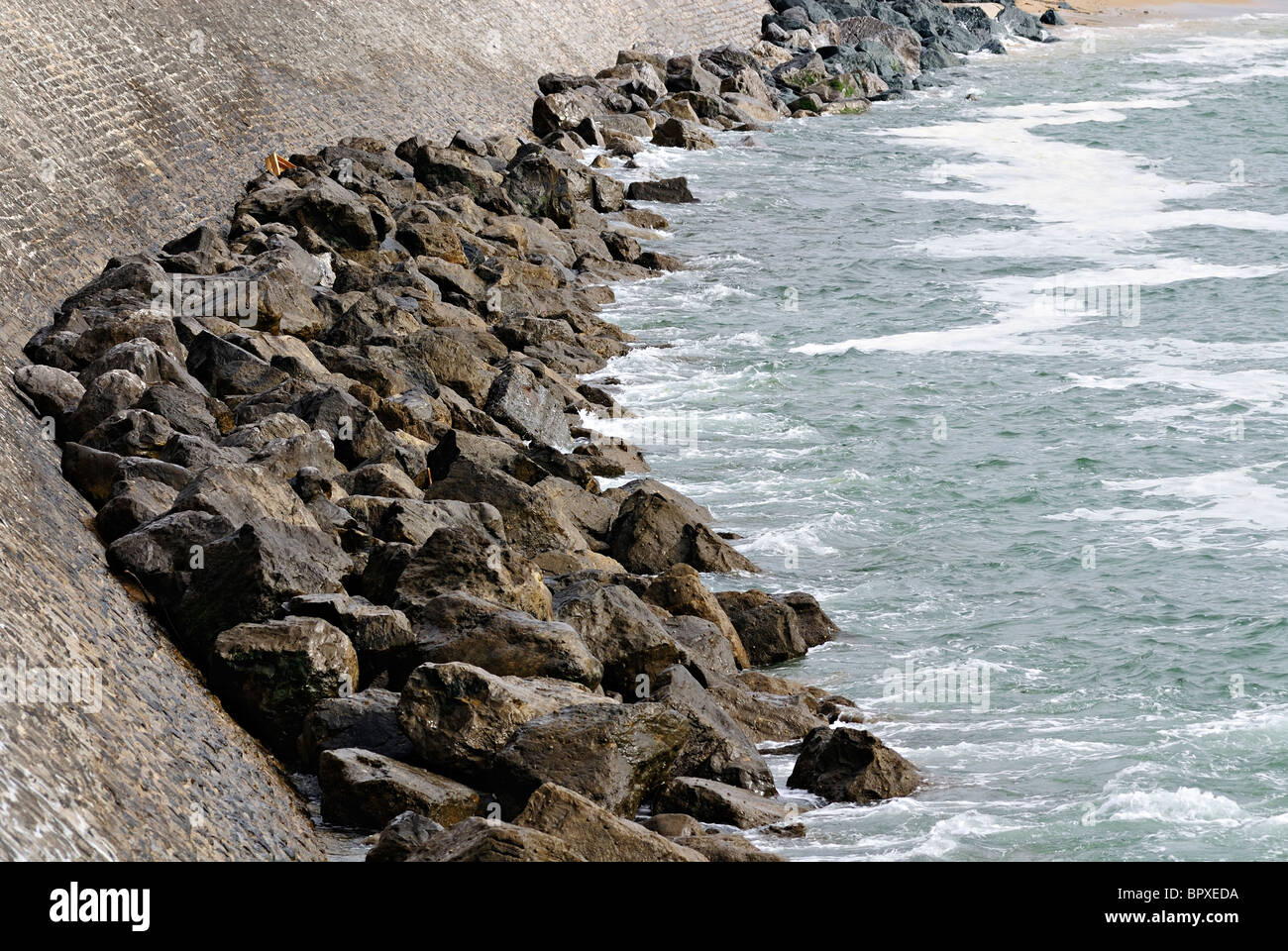 Algal bloom scum water pollution on the seawall shore of Saint Jean de ...