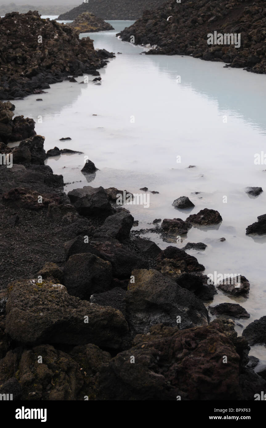 Geothermal seawater in a pool surrounded by rocks at the Blue Lagoon ...