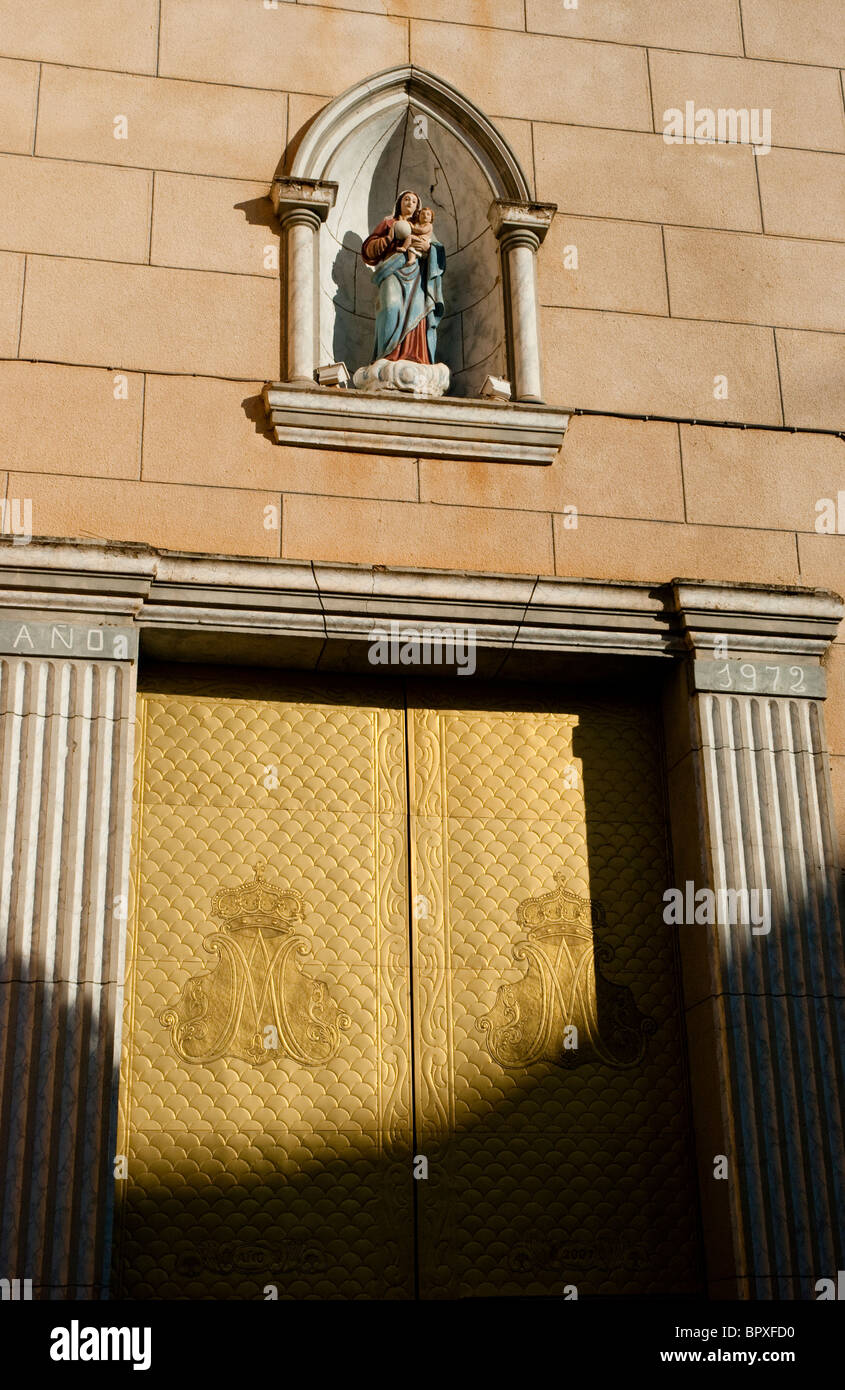 Gold entrance door to village church in Chella, Spain Stock Photo - Alamy