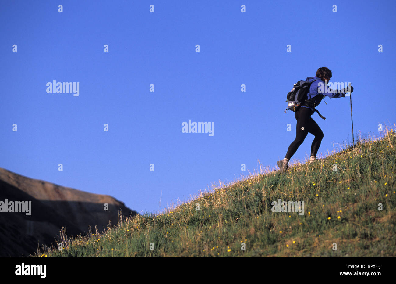 Woman hikes up hill hi-res stock photography and images - Alamy