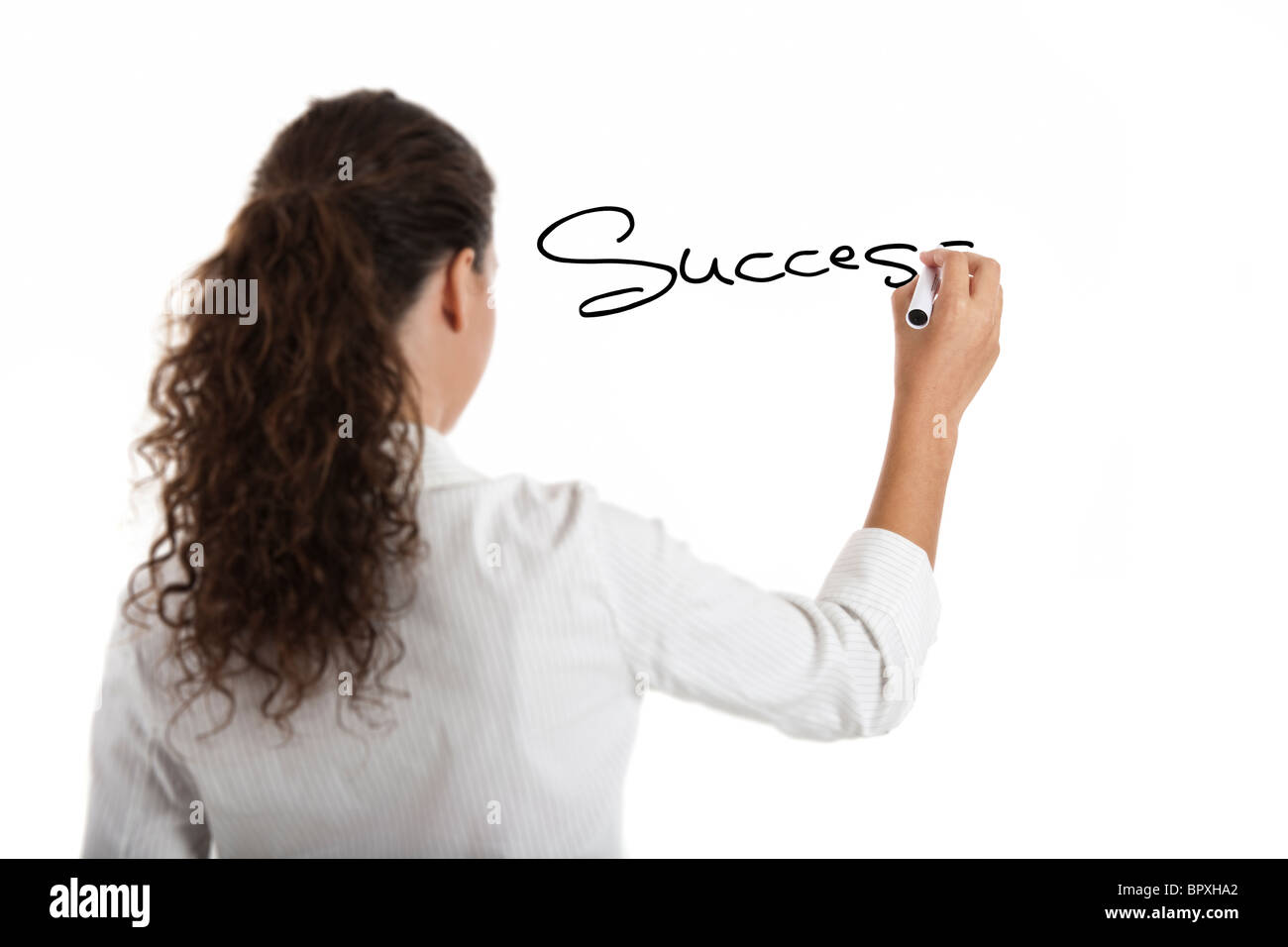 Young businesswoman drawing the word success, isolated on white ...