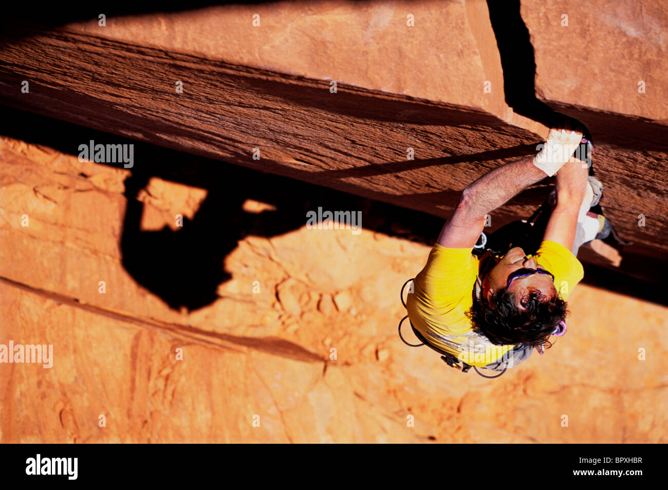 Man rock climbing, Lake Powell, Utah Stock Photo - Alamy