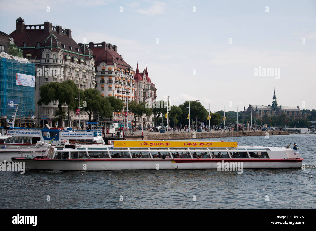 A view of the colourful buildings as seen from a sightseeing boat with ...