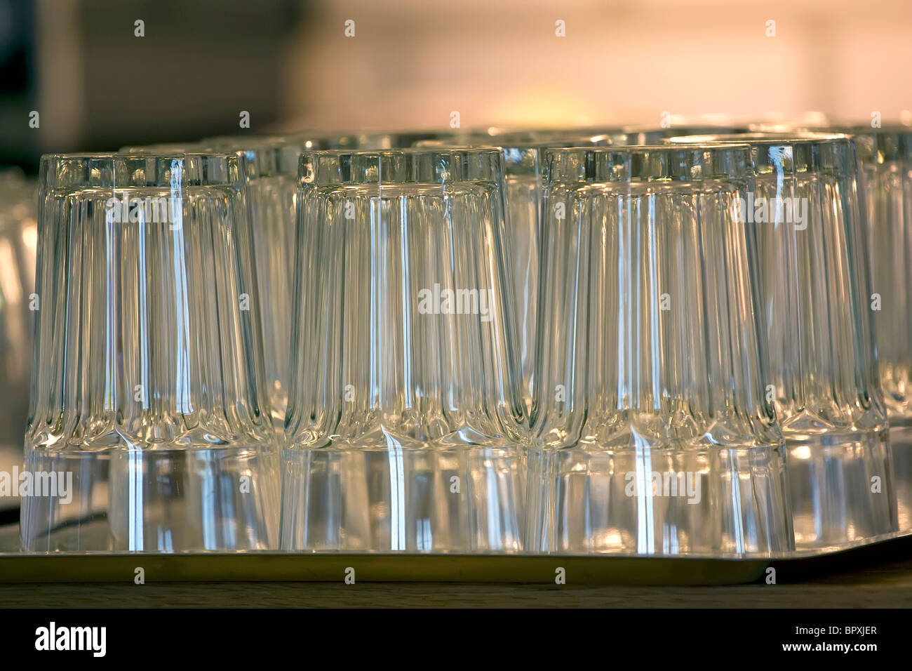Upside down drinking glasses on a tray Stock Photo - Alamy