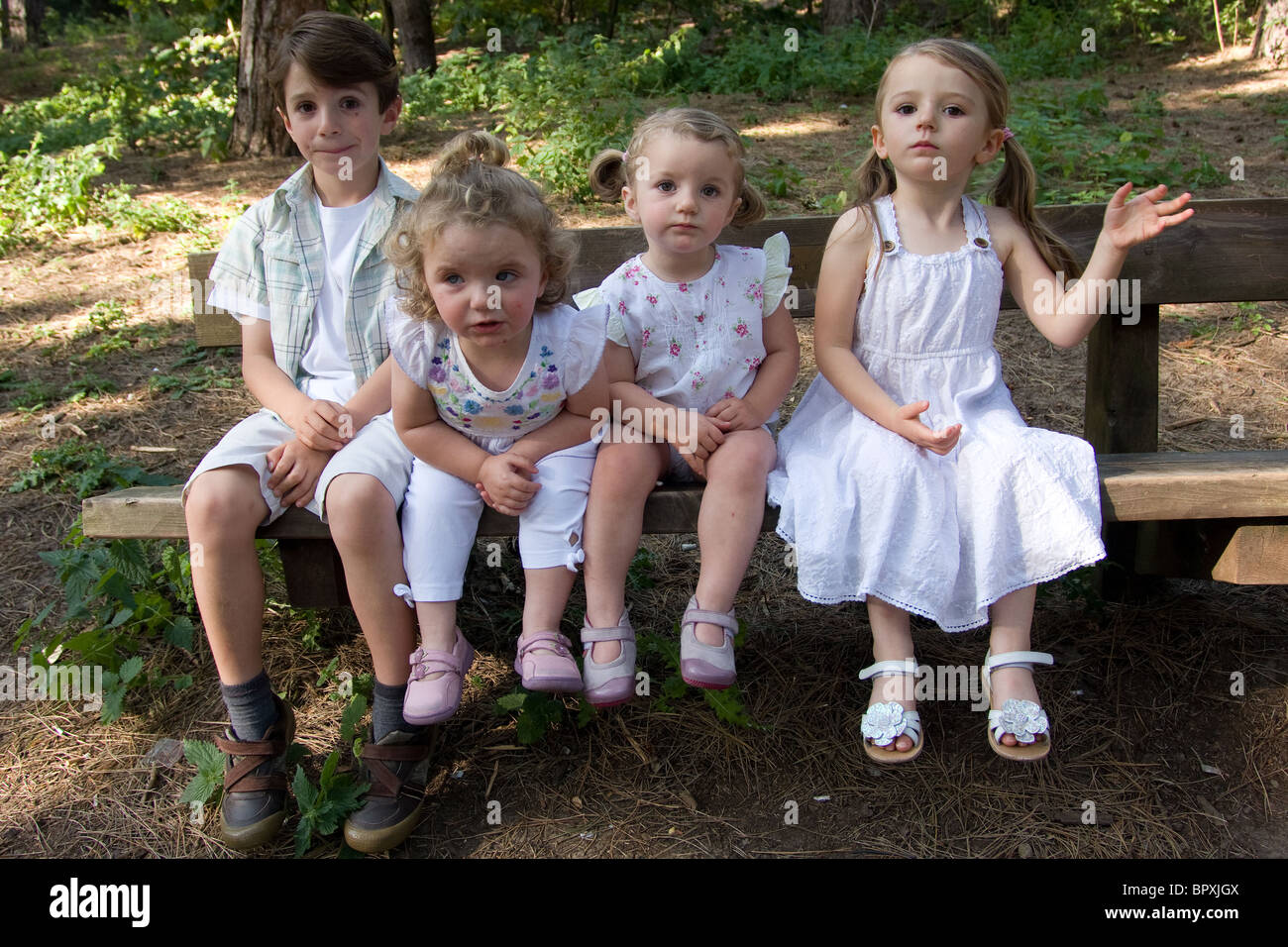 twins toddler child pose engaging brother sisters Stock Photo - Alamy