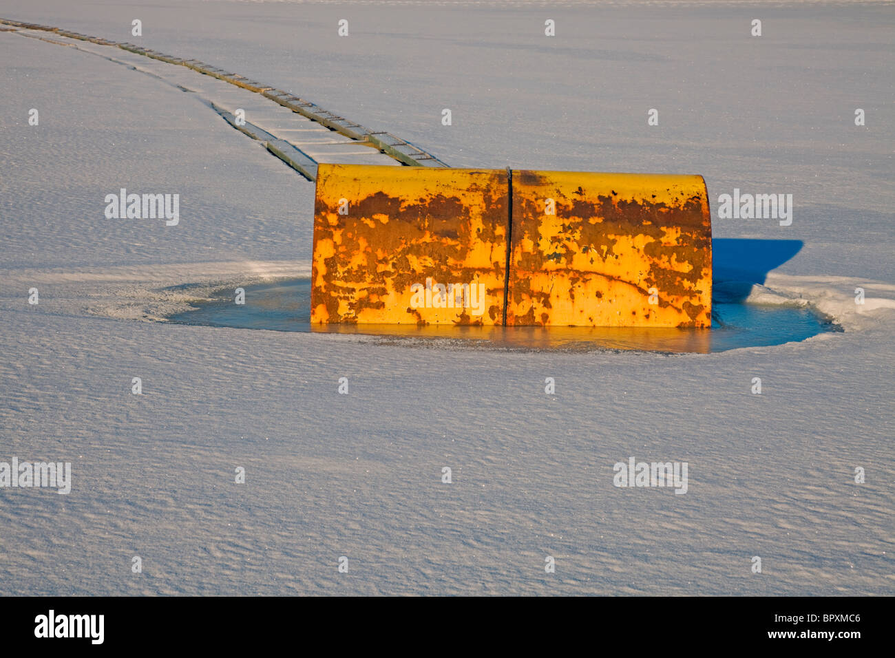 Yellow barrel in the lake Stock Photo - Alamy