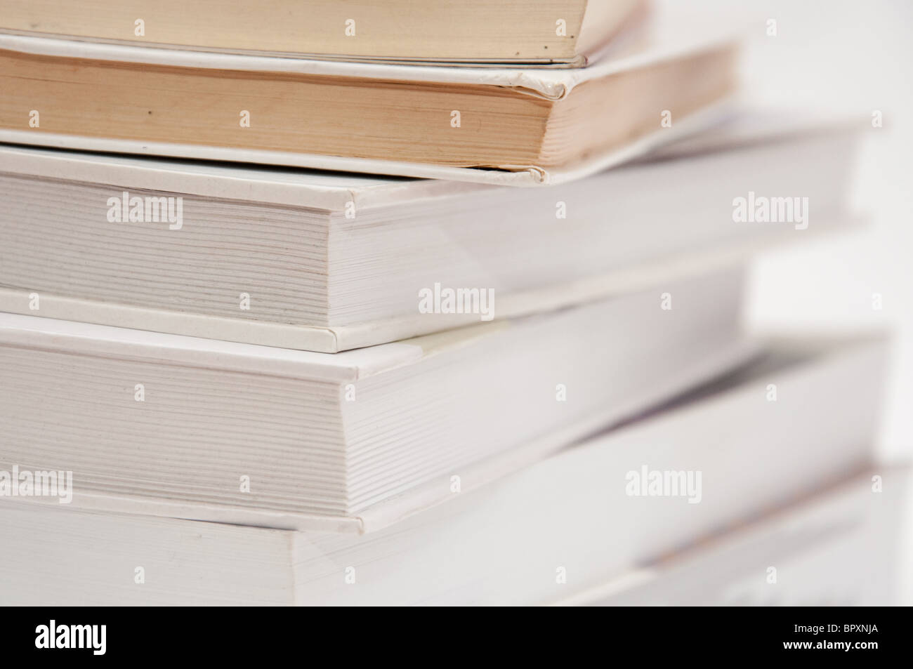 Stack of books over a white background Stock Photo - Alamy