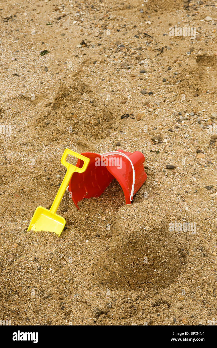 A bucket, spade and sandcastle Stock Photo - Alamy