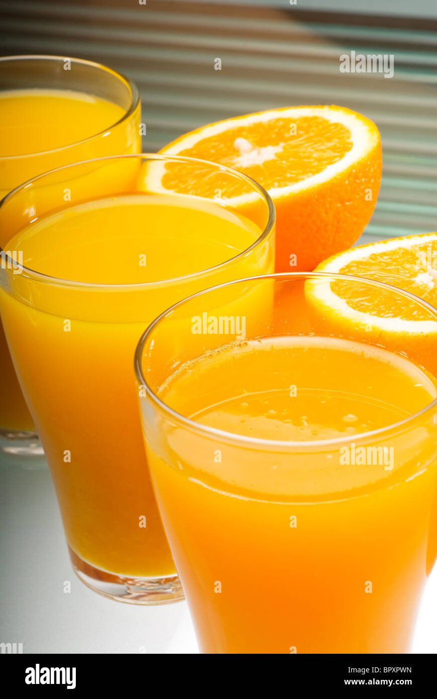 fresh and healthy orange juice ,unfiltered ,over a light table Stock ...