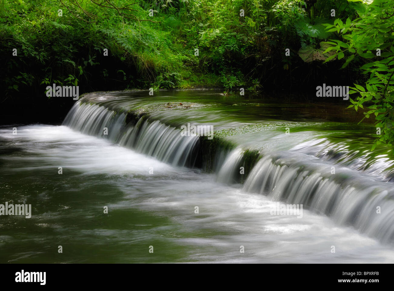 small waterfall monsal dale river wye Derbyshire england UK Stock Photo ...