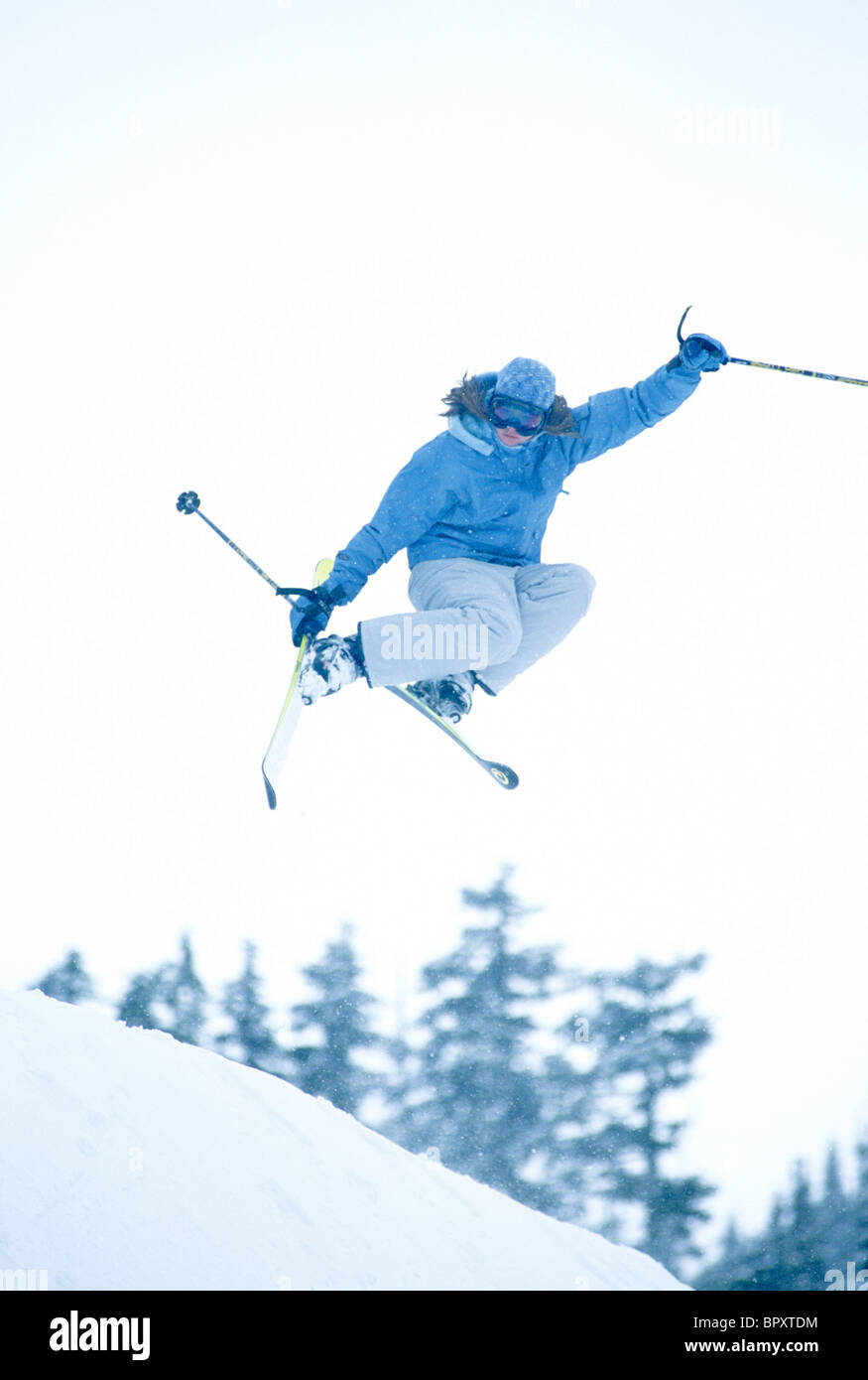 A female skier jumps a lip in the terrain park at Whistler Mountain ...