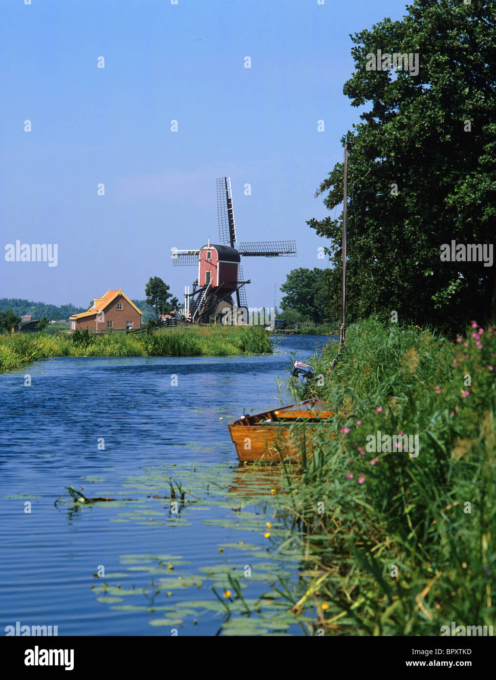 Canal and windmill scene near the village of Oud Ade Stock Photo - Alamy