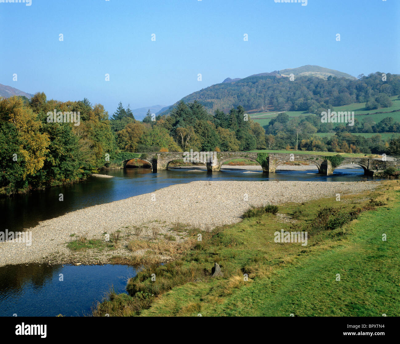 View of the bridge crossing the River Mawddach near Dogellau Stock ...