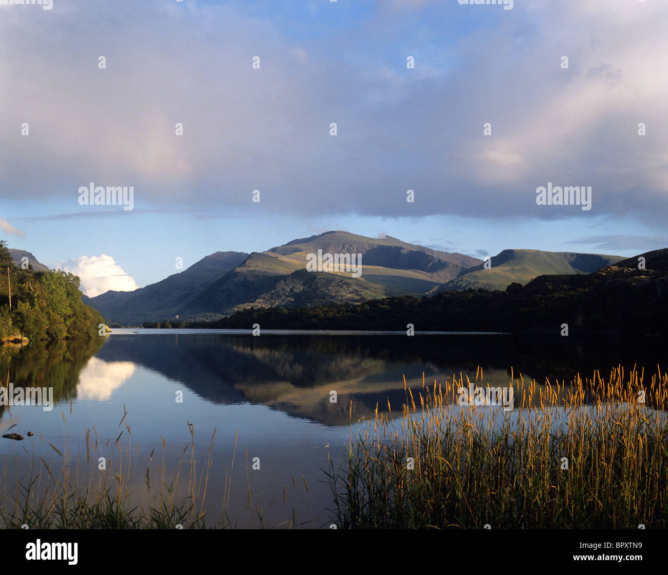 Beautiful evening reflections of Snowdon in the calm waters of Llyn Padarn in the Snowdonia ...