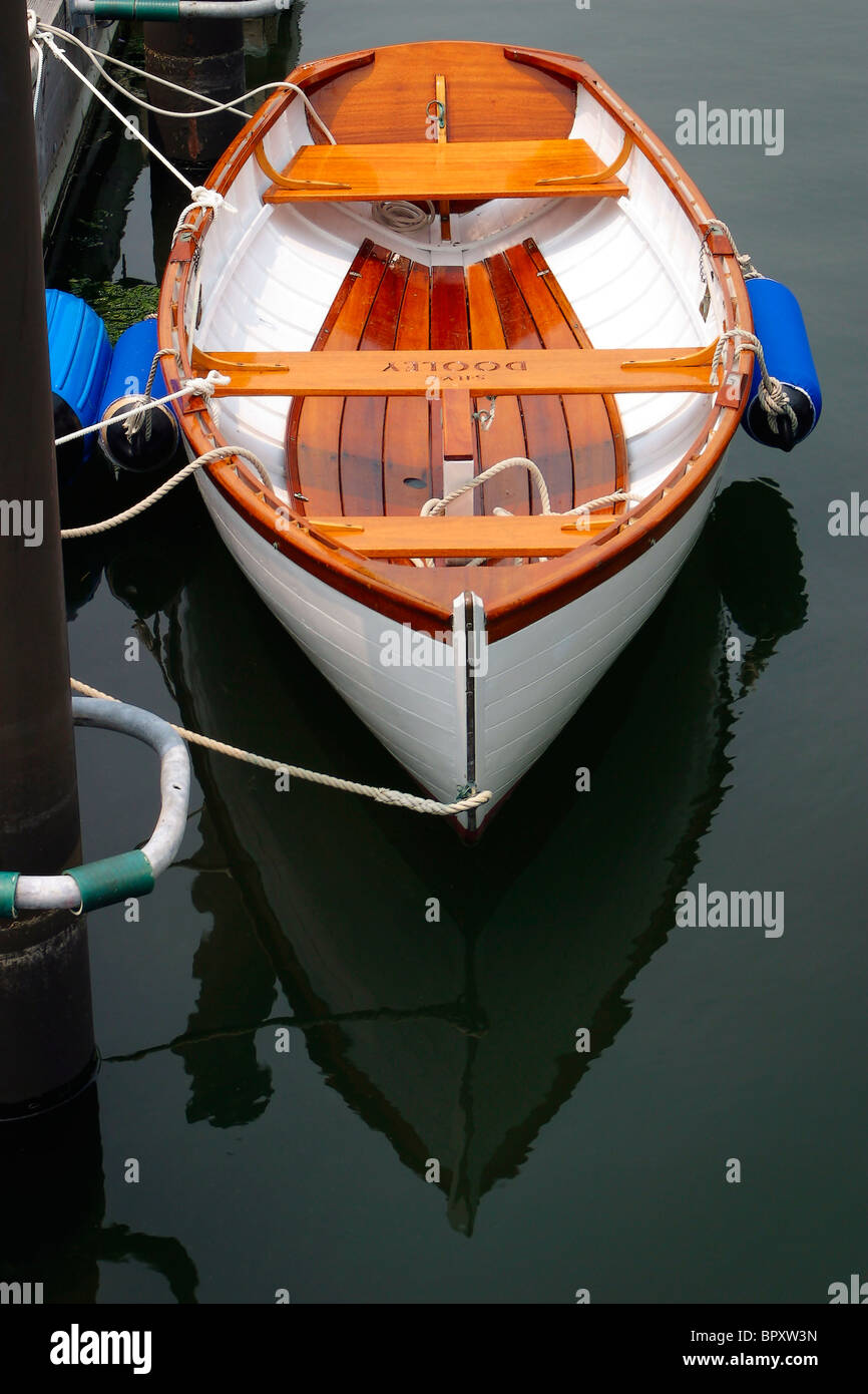 Row boat tied up to dock on Long Island Sound Stock Photo - Alamy