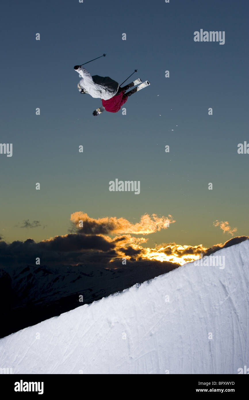 Skier does an air in half pipe at sunset Stock Photo - Alamy