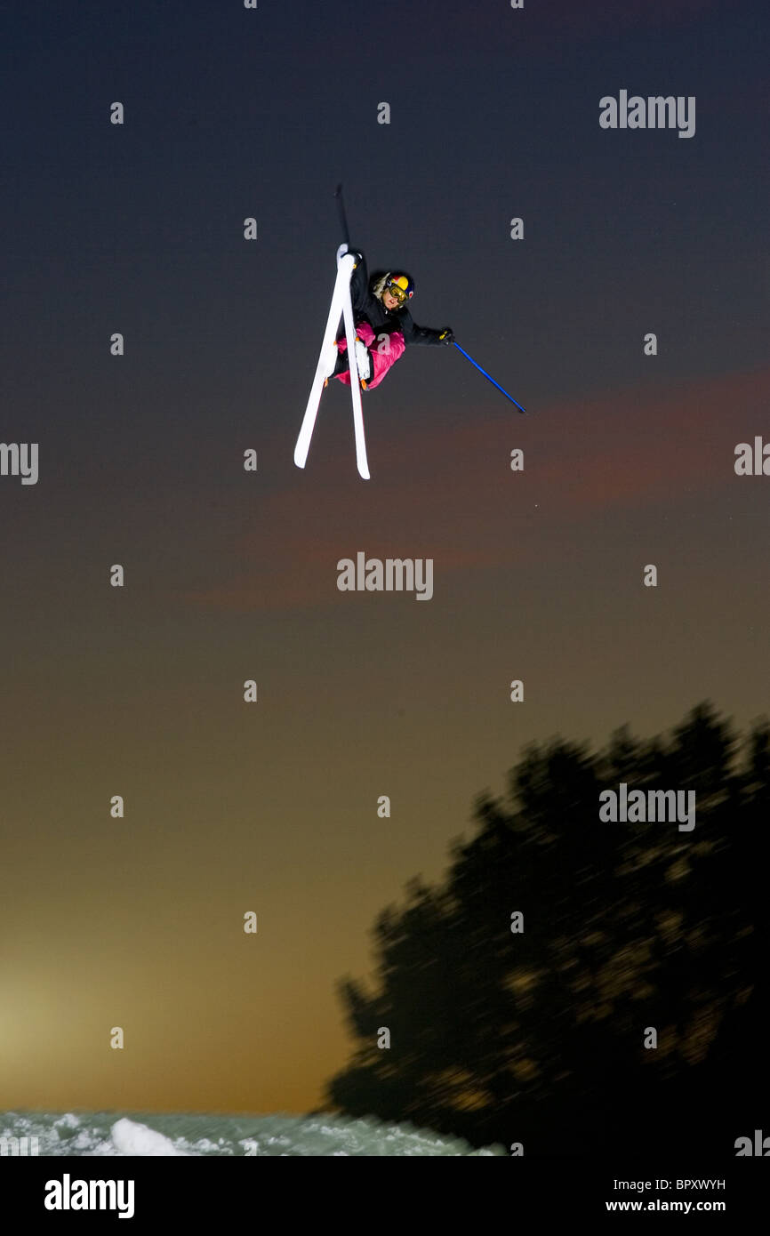 Skier jumps at sunset Stock Photo - Alamy