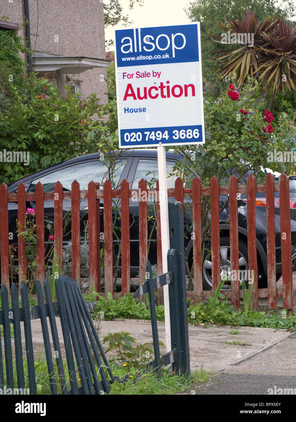 An auction sign outsde an empty house New Malden London UK Stock Photo ...