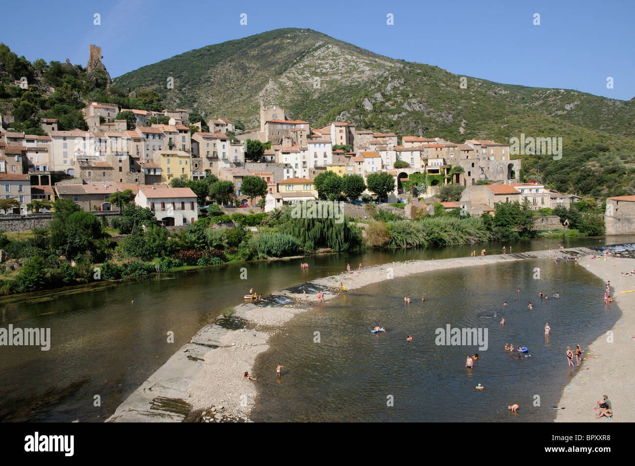 Bathing in River Orb in the old town of Roquebrun on the River Orb in ...