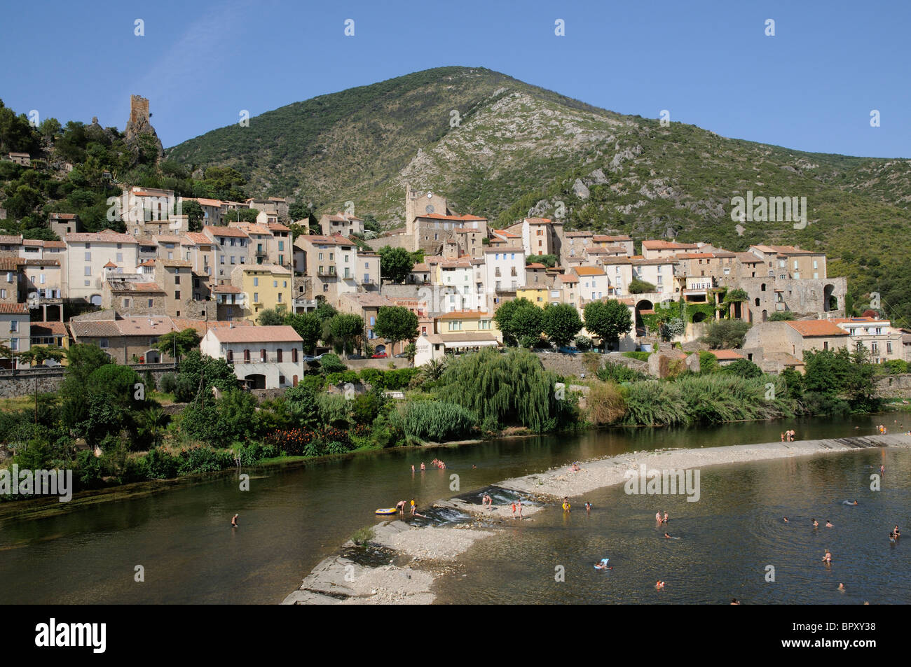 Bathing in River Orb in the old town of Roquebrun on the River Orb in ...