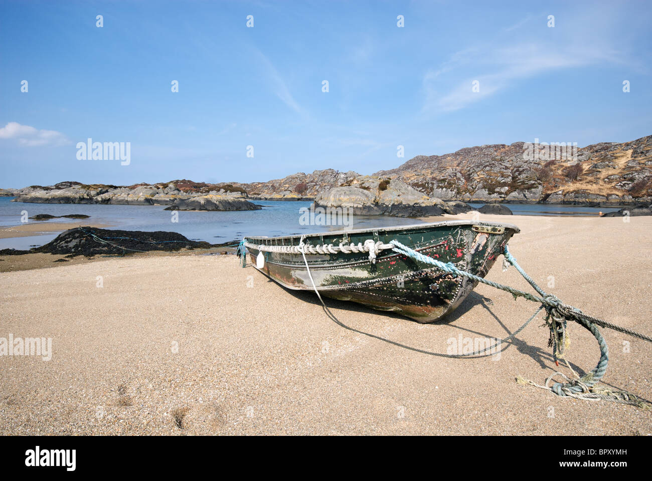 A small rowing boat moored in Kentra Bay, Ardnamurchan, Scotland, UK ...