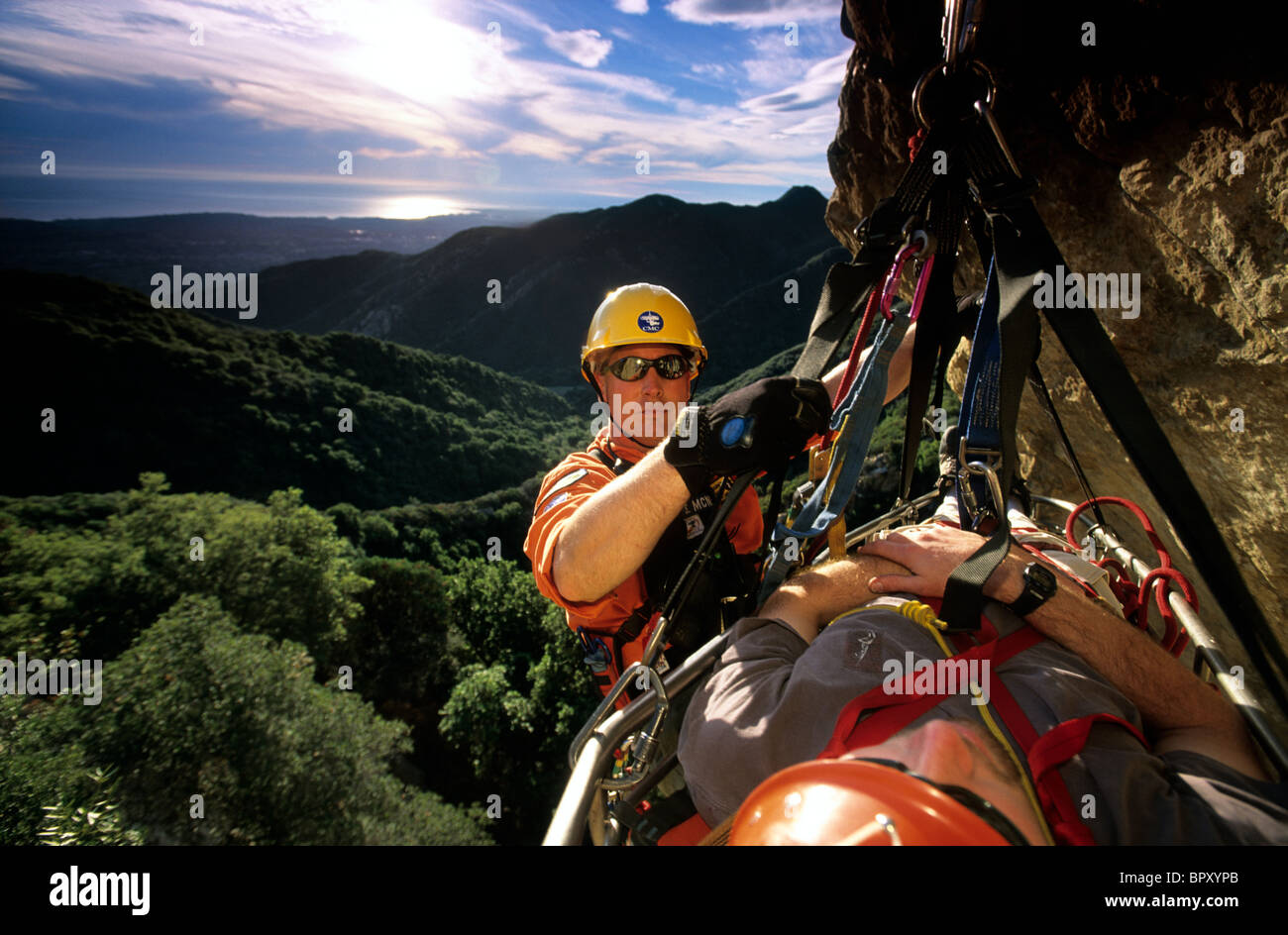 Search and Rescue climber tending body in litter, Santa Barbara, CA ...