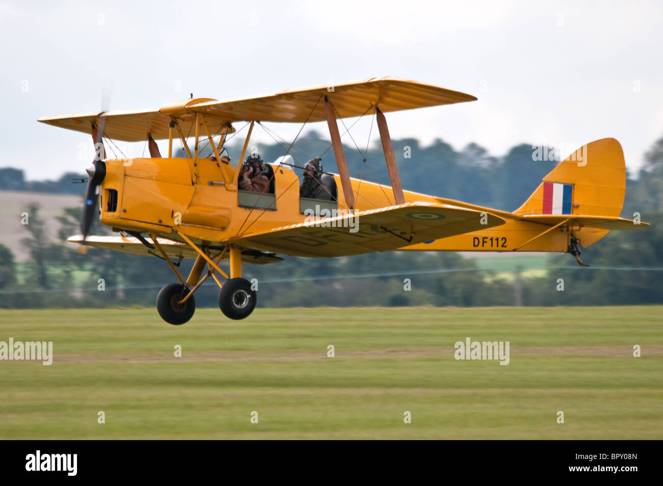 de Havilland DH 82 Tiger Moth biplane landing at Duxford Stock Photo ...