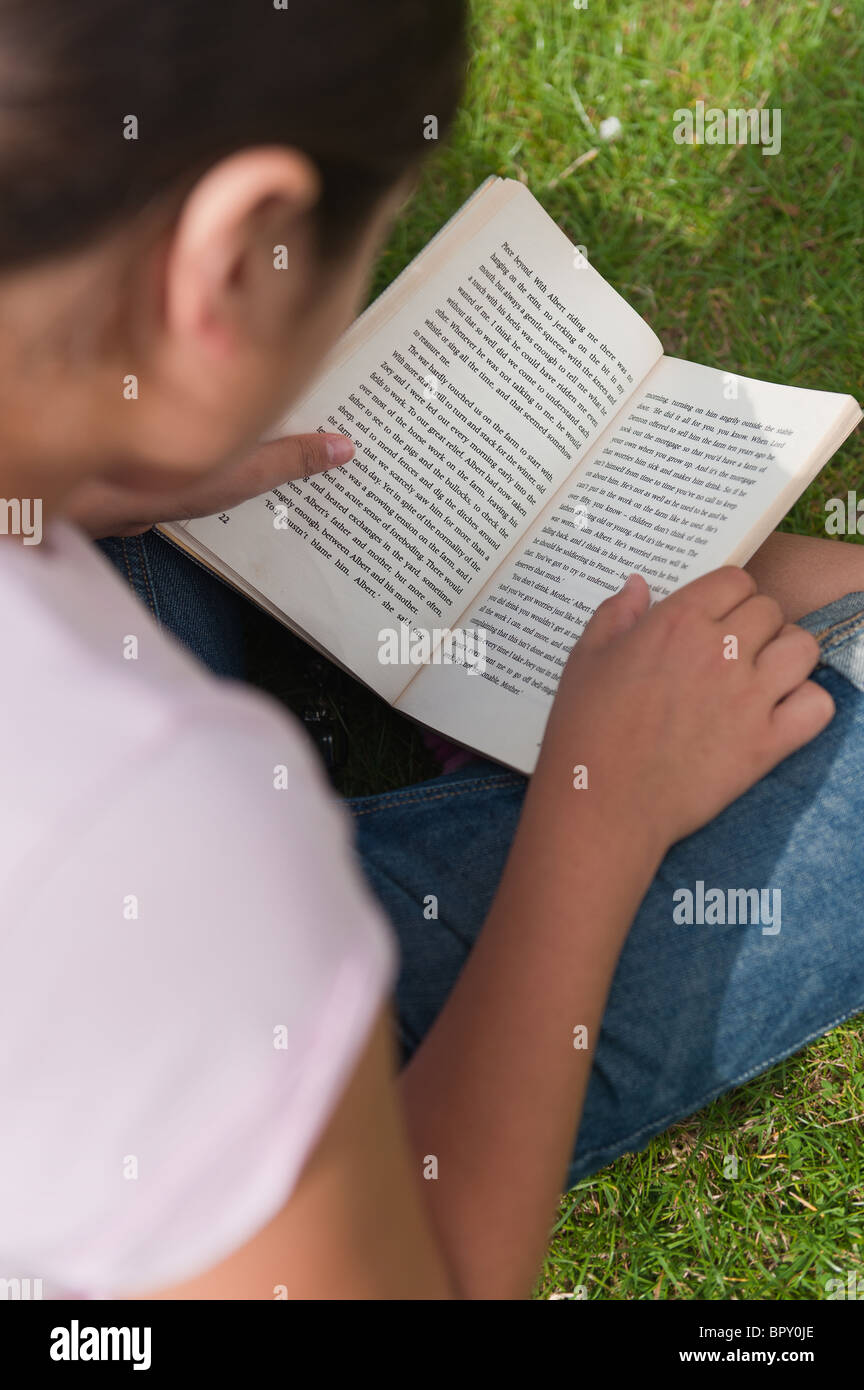 kids reading outside in the garden and enjoying a break from technology ...