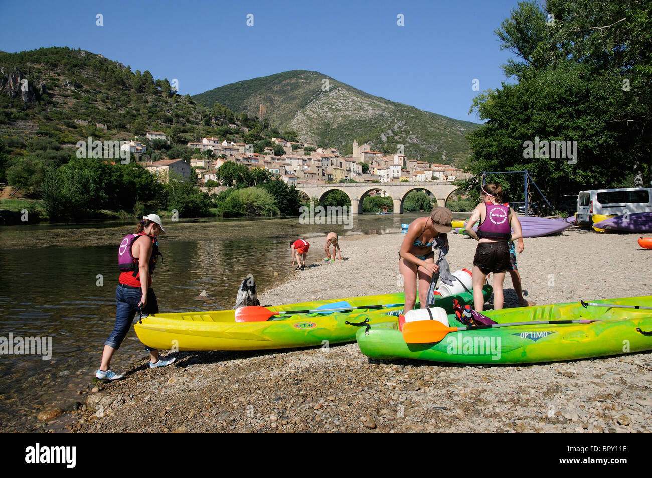 Kayaks for hire on the River Orb in the old town of Roquebrun in the ...