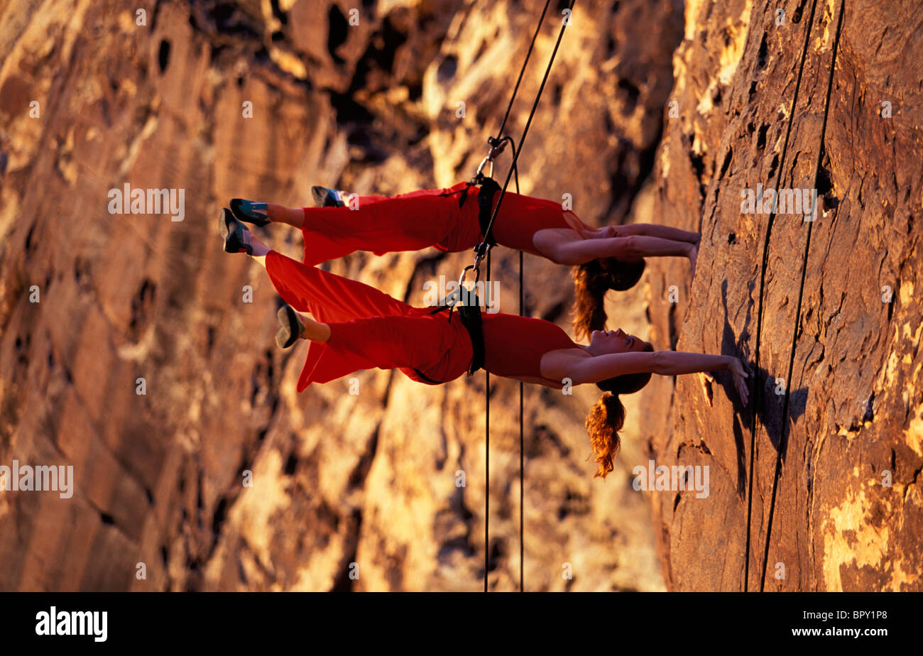 Aerial dancers perform in high angle environments while dangling from ...