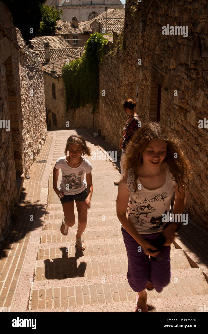 children running up steps in street in Assisi in Umbria Italy Stock ...