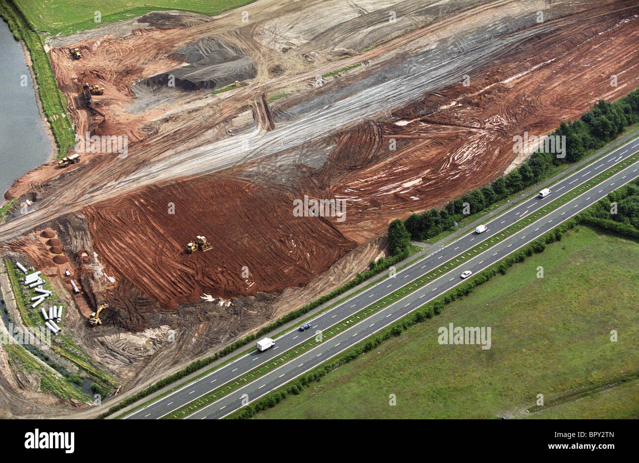 Aerial view of the M6 Toll motorway under construction next to the A5 ...