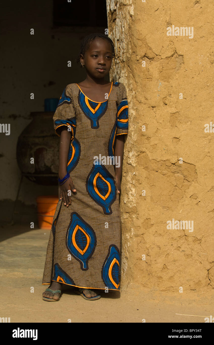 girl at the entrace of a typical mud house, Matam, Senegal Stock Photo ...